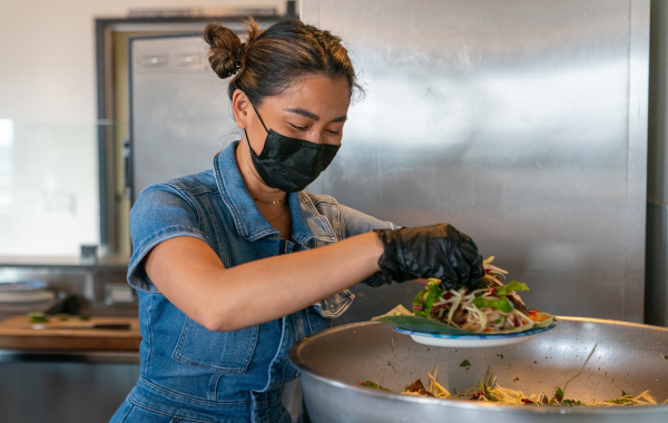 Sandy Thongsavat-Potter of Sandy's World of Eats prepares a papaya ...